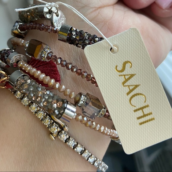 SAACHI | Jewelry | Saachi Champagne Colored Tassel Coil Bracelet | Poshmark
